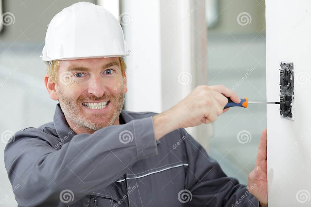 Electrician with Screwdriver Fixing Socket Stock Image - Image of home ...