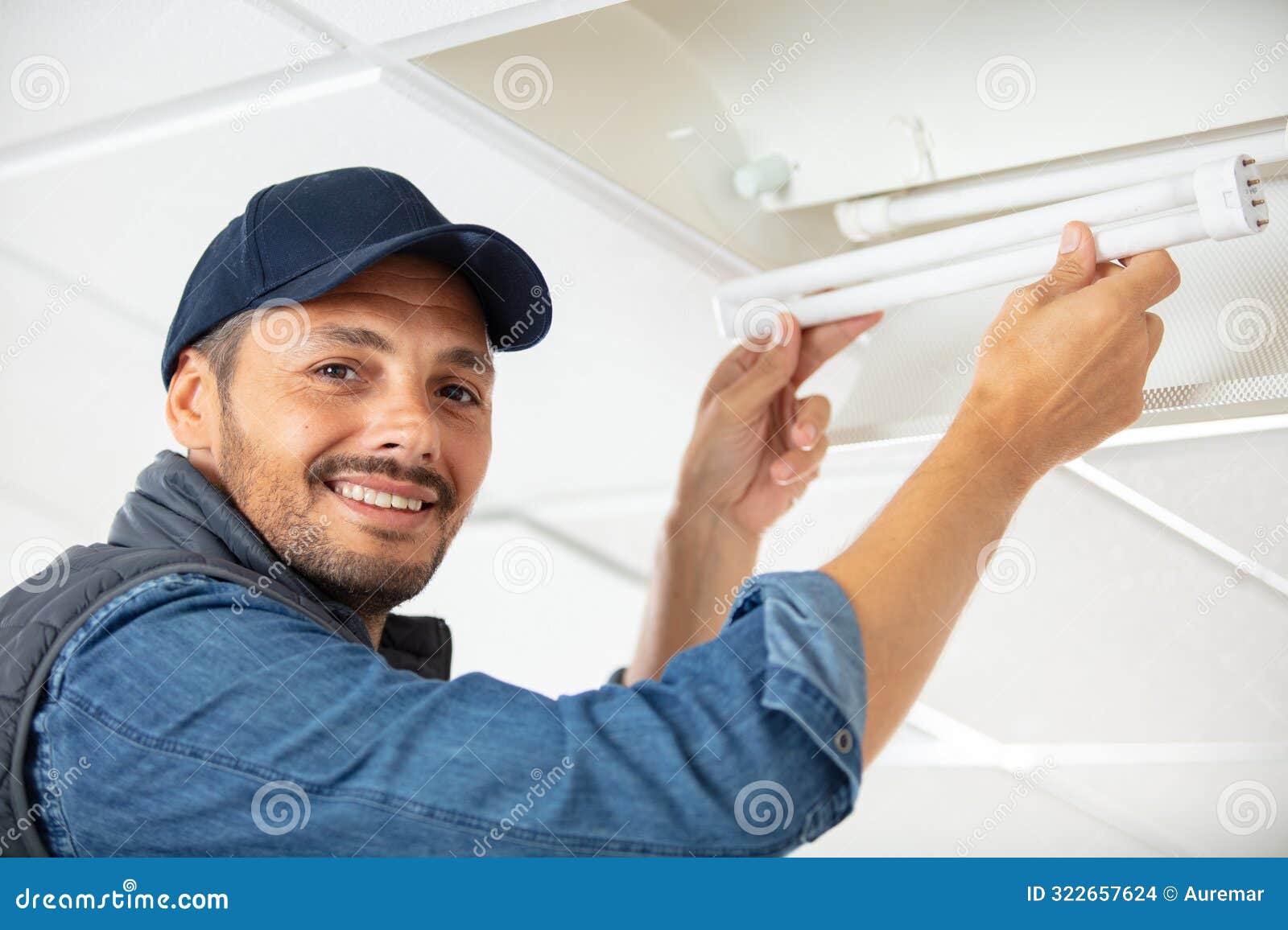 Electrician Setting Light Bulb for Temporary Lighting Stock Photo ...