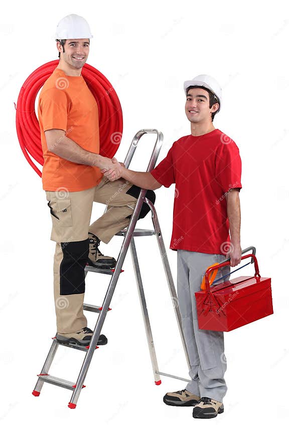 Electrician shaking hands stock image. Image of hardhat - 35514327