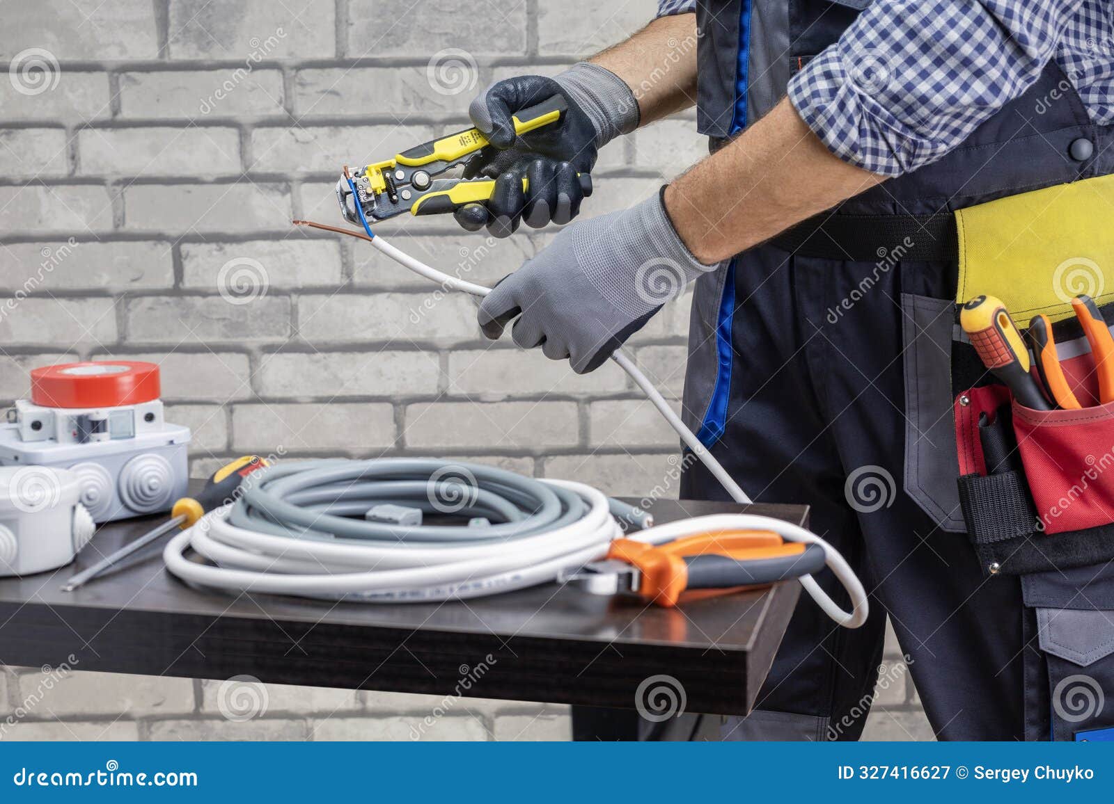 Electrician Stripping Insulation from Wire. Man Electrician Working ...