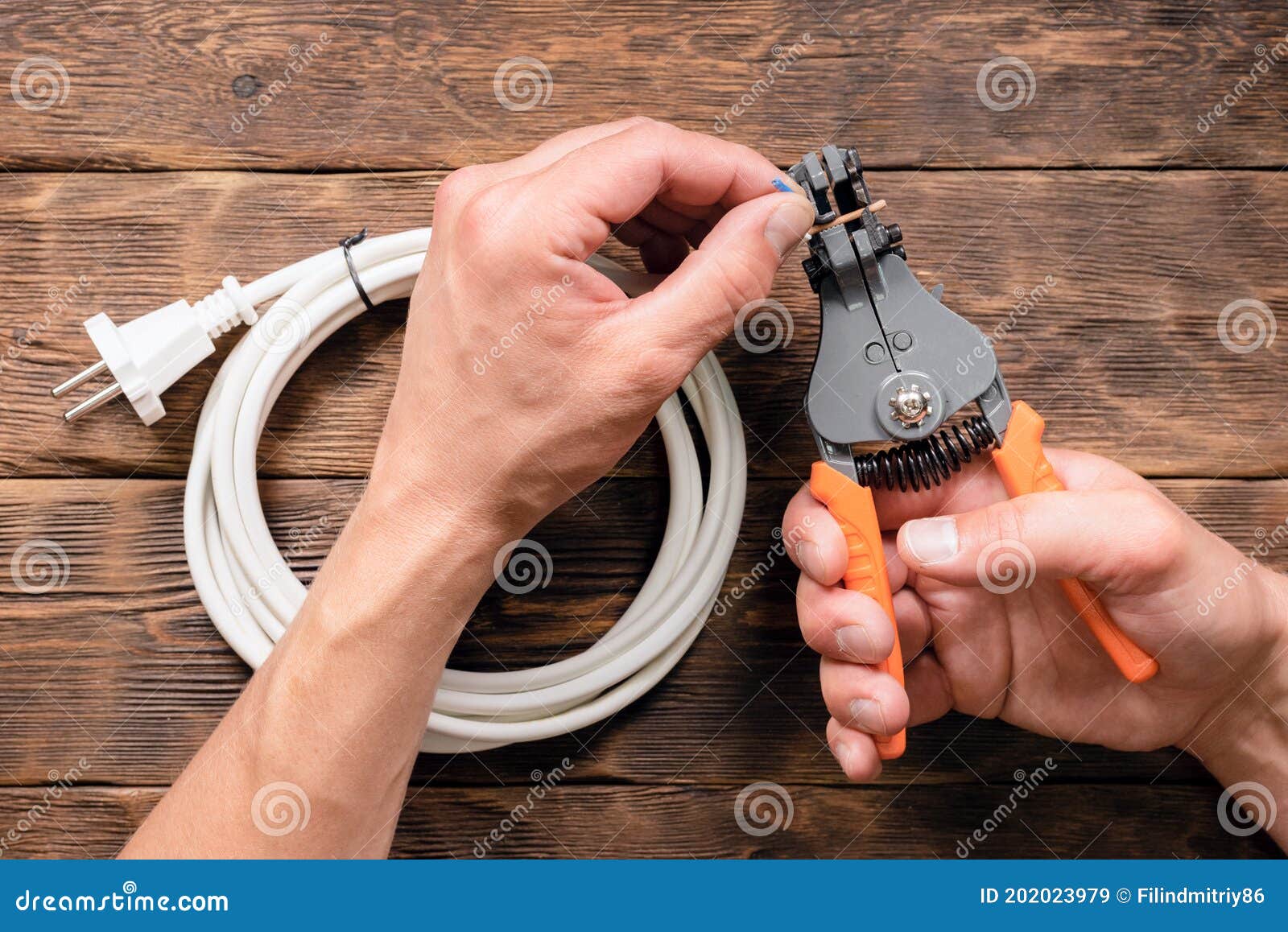 An Electrician Strips Electrical Wires. Yellow Wire Cutters Strip The ...