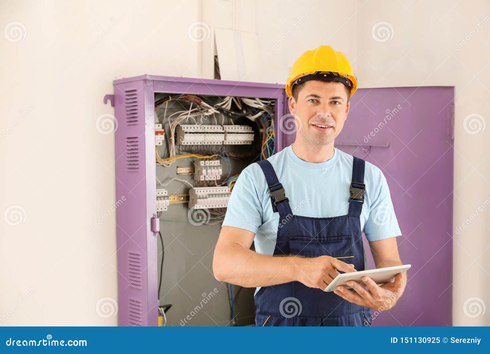 Electrician with Tablet PC Near Distribution Board Indoors Stock Image ...
