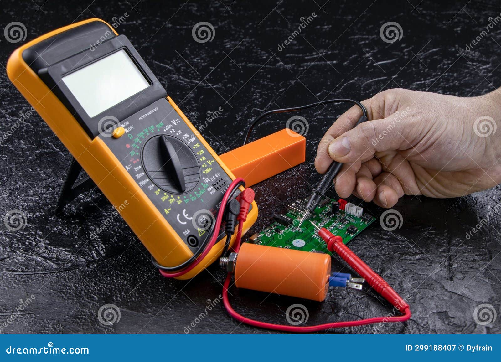 An Electrician Takes Readings from a Microcircuit Using a Multimeter ...