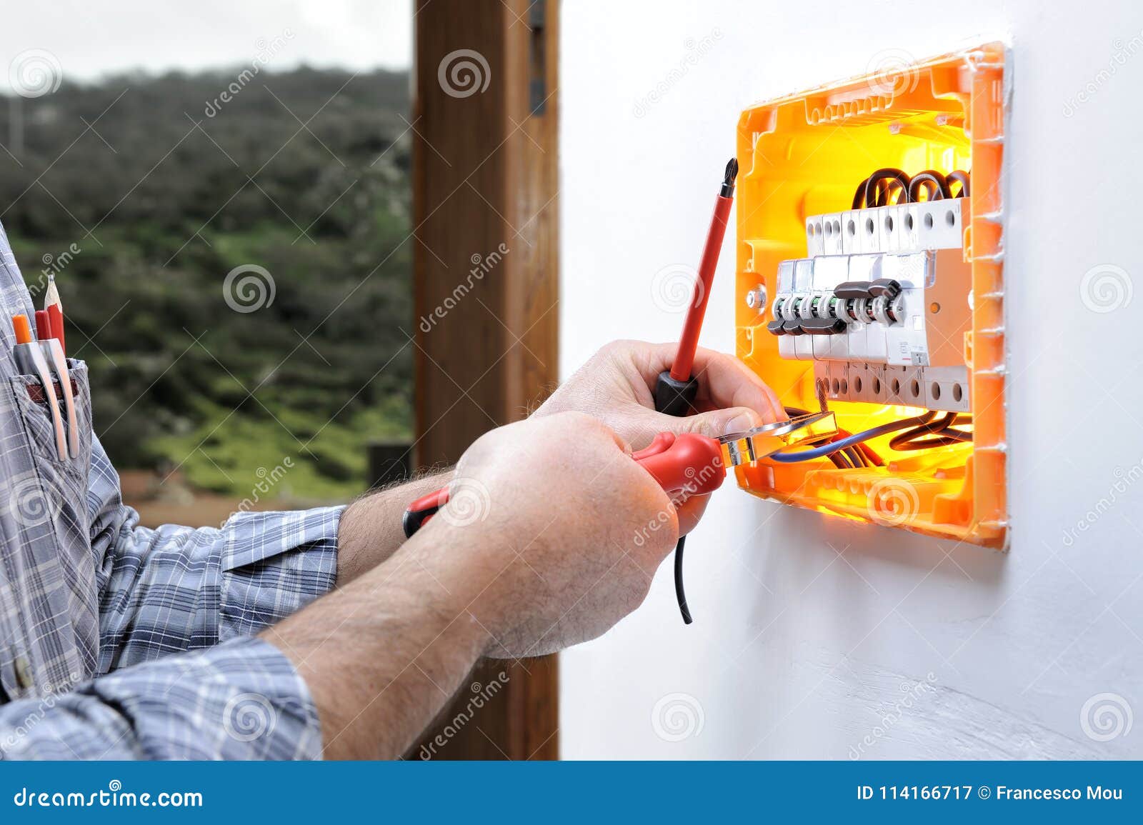 Electrician Technician Repairs the Electrical Panel of a Residential ...