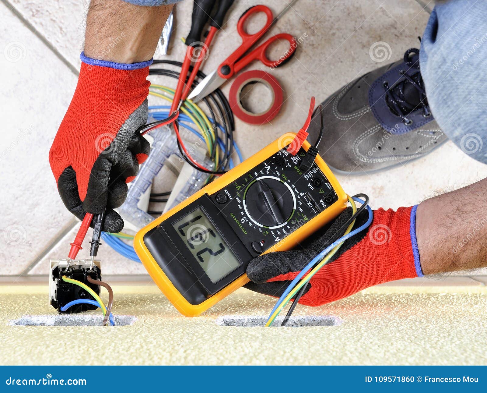 Electrician Technician at Work with Safety Equipment on a Residential ...