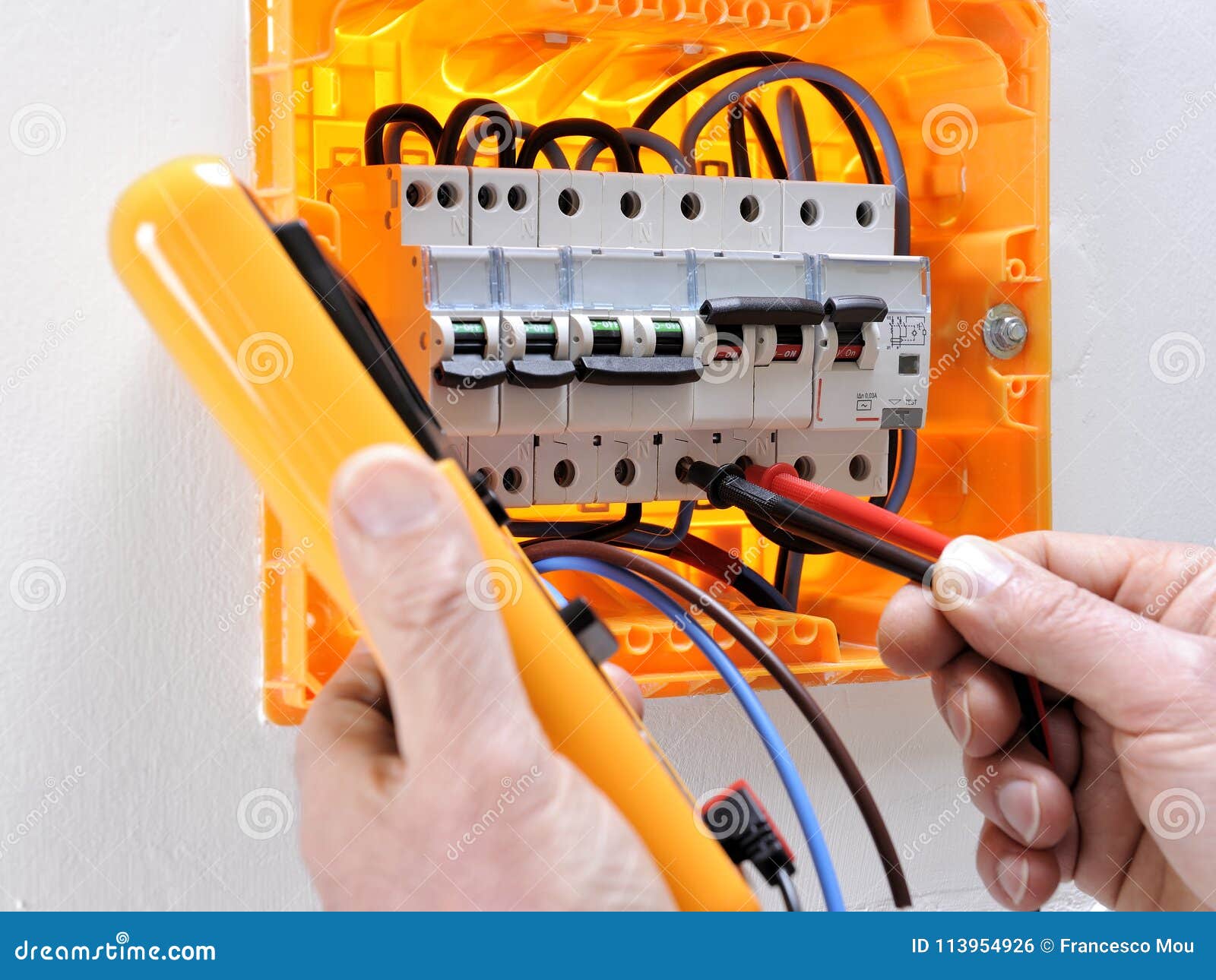 Electrician Technician at Work on a Residential Electric Panel Stock ...