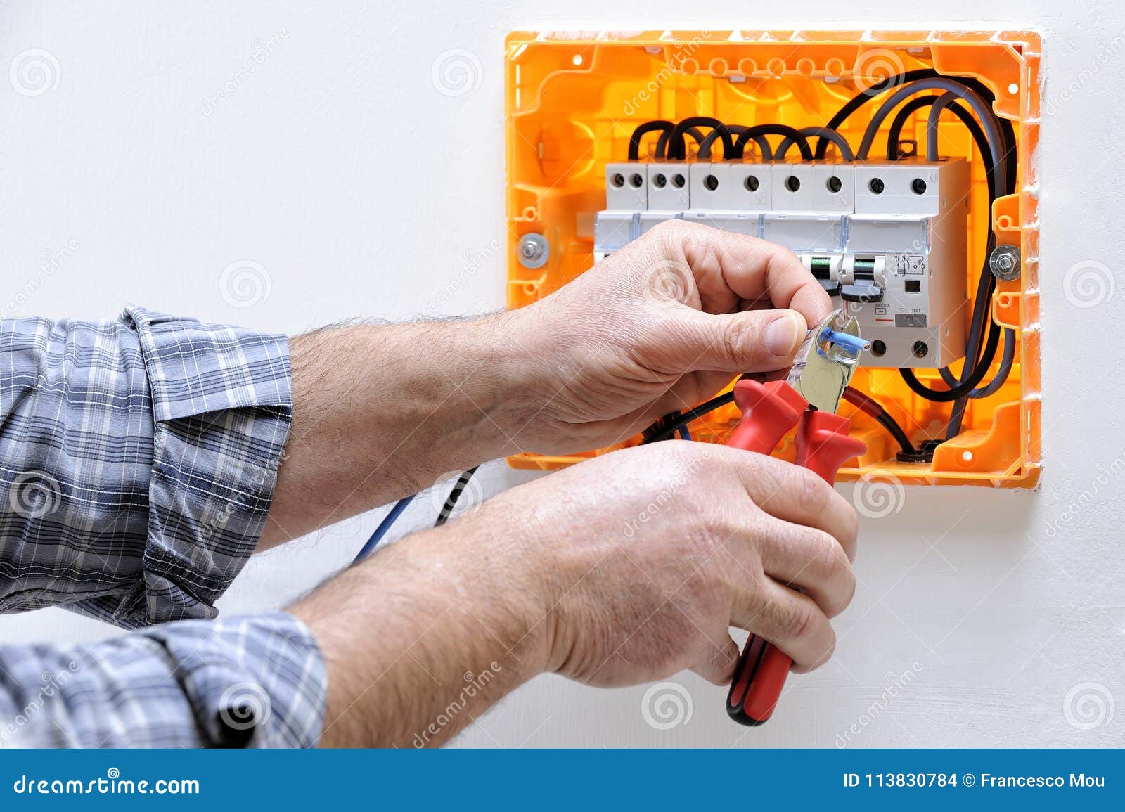 Electrician Technician at Work on a Residential Electric Panel Stock ...