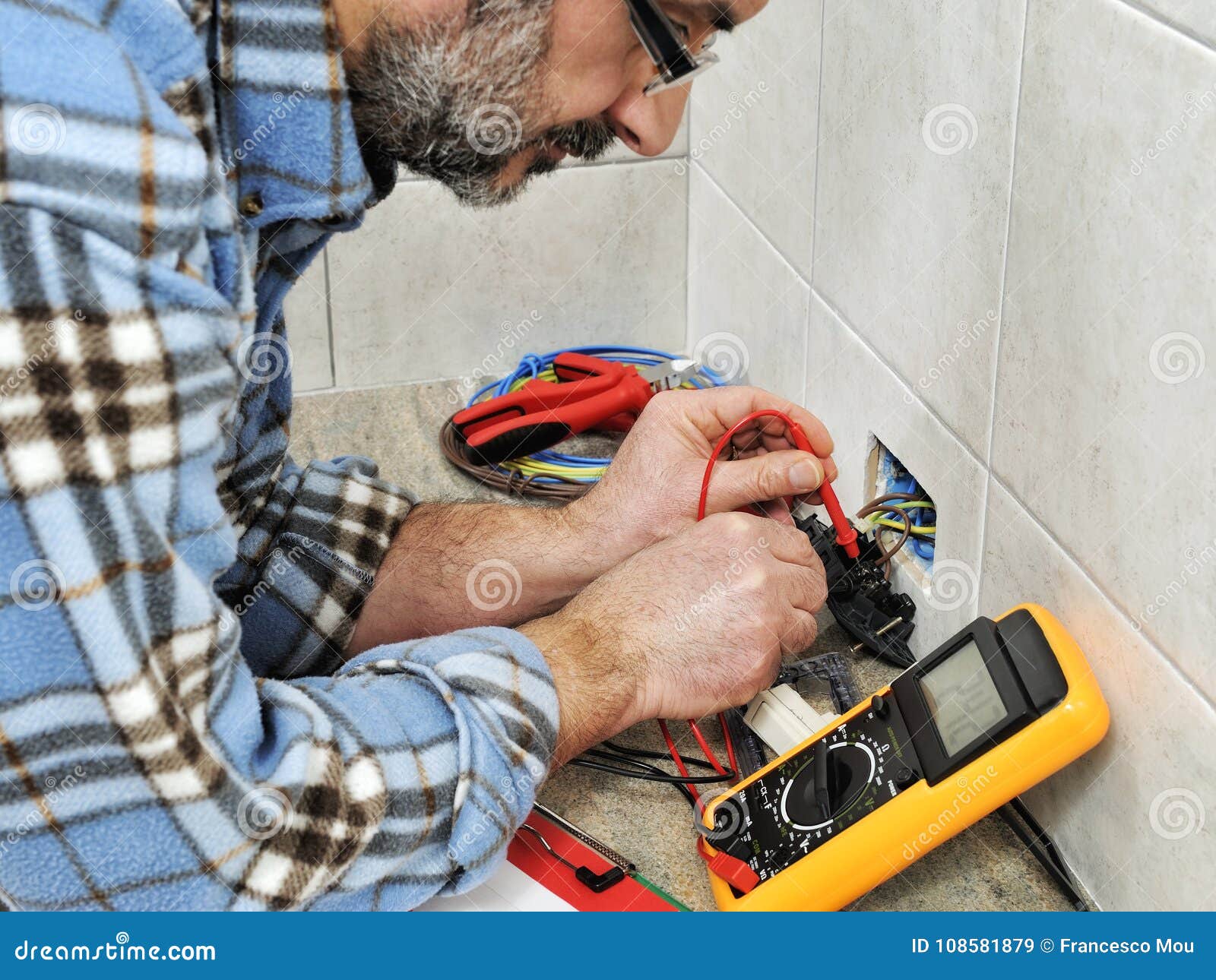 Electrician Technician at Work on a Residential Electric System. Stock ...