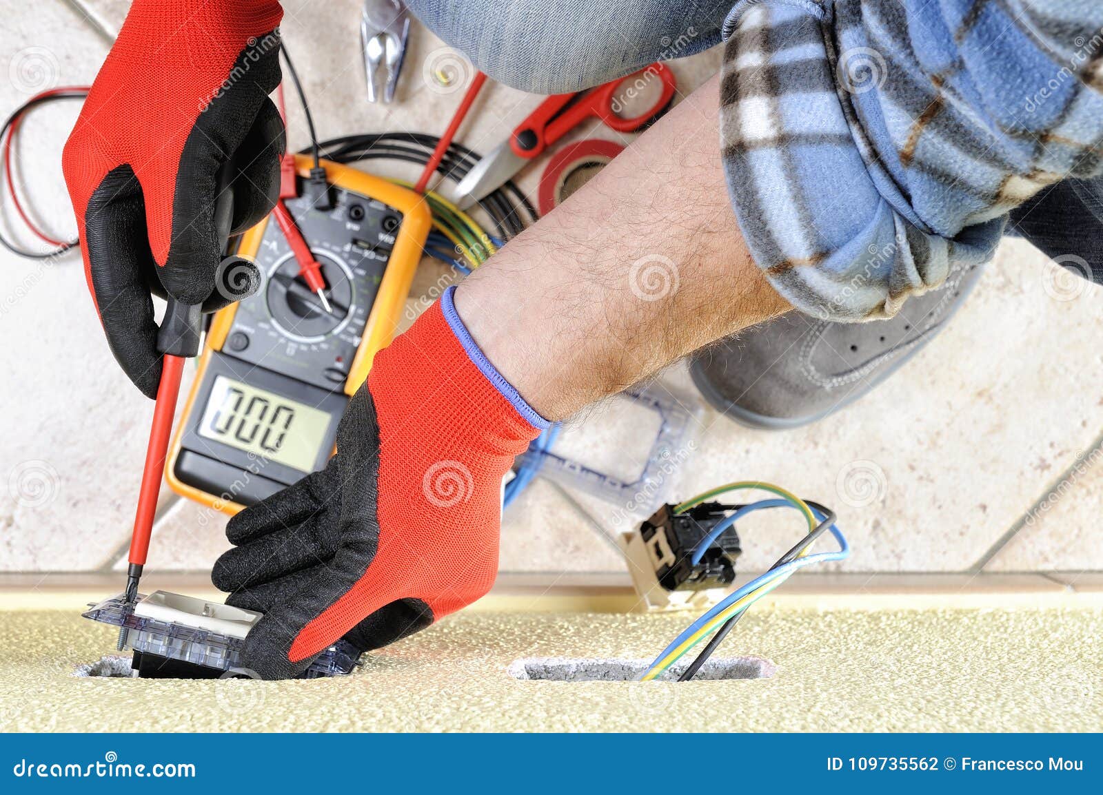 Electrician Technician at Work with Safety Equipment on a Residential ...