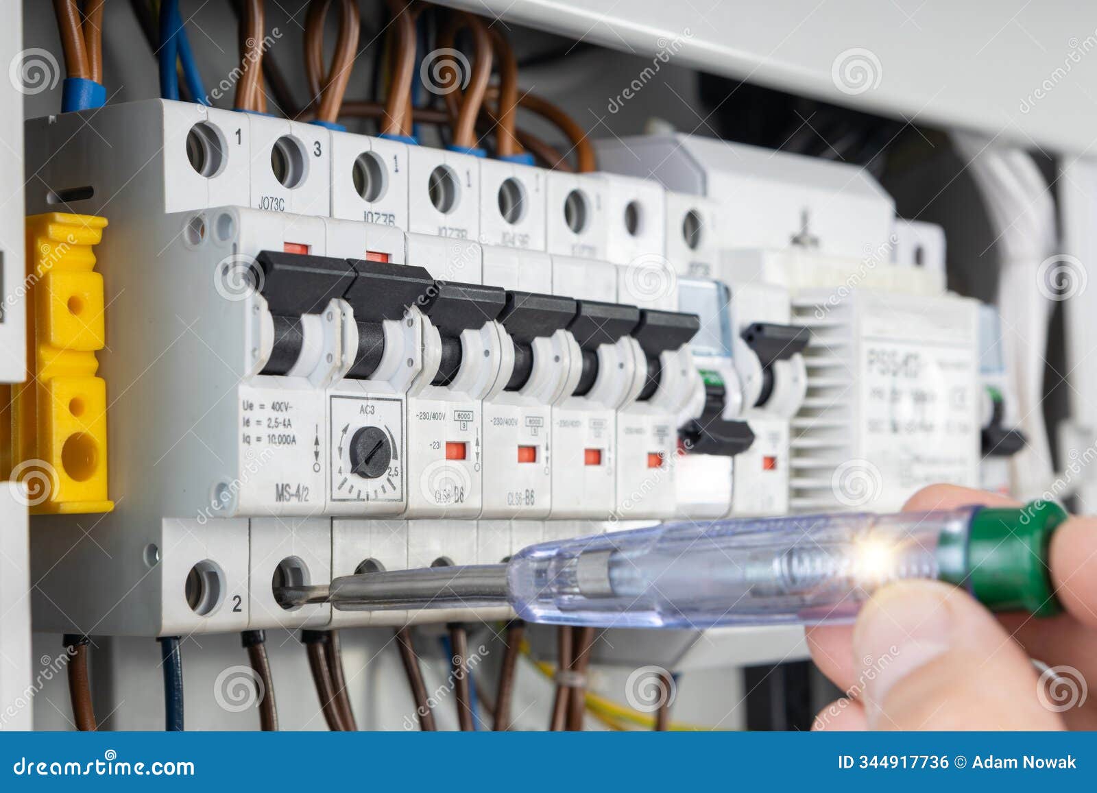 Electrician Testing Circuit Breakers with Voltage Tester Stock ...