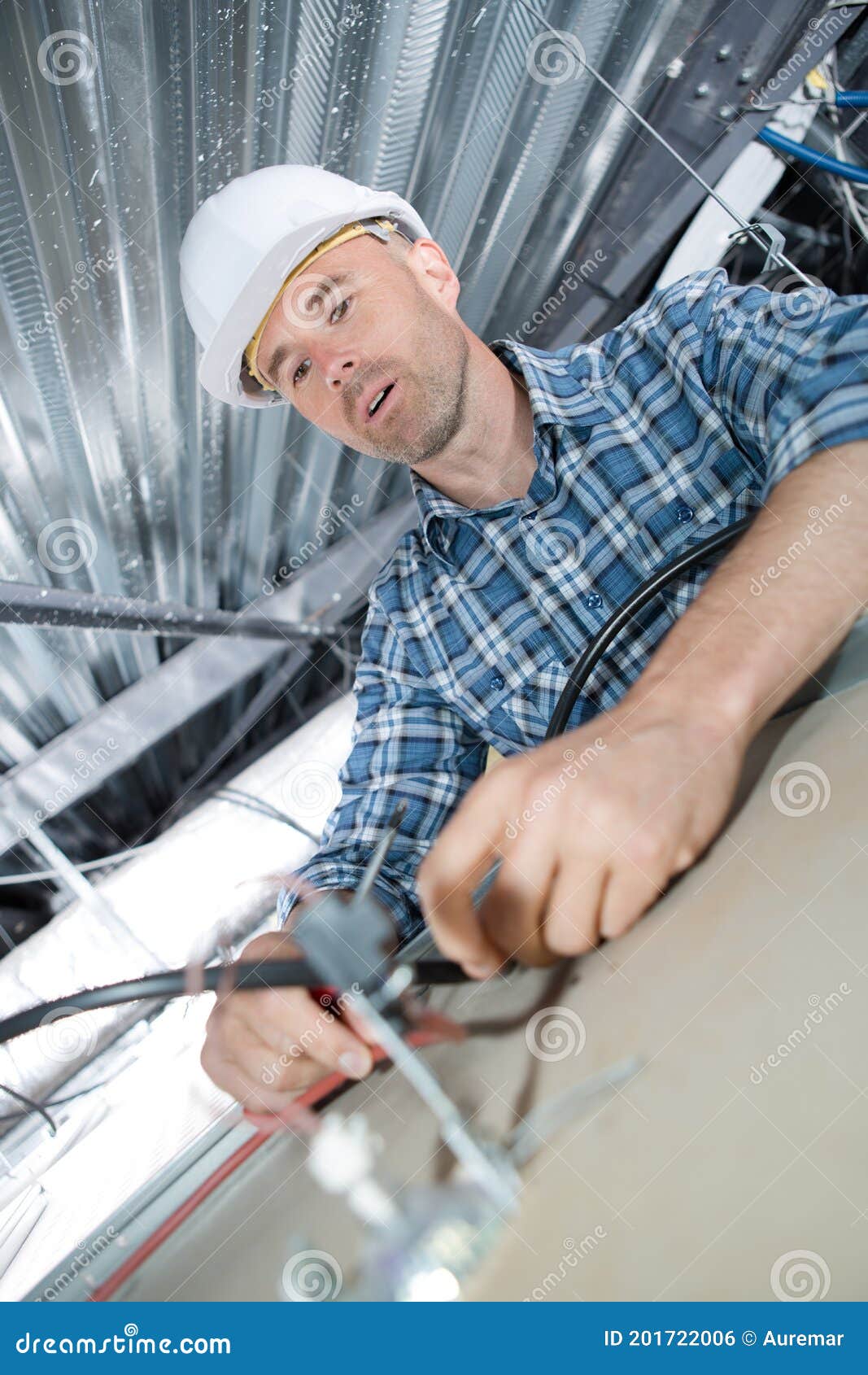 Electrician Tightening Electrical Support on Ceiling Stock Photo ...