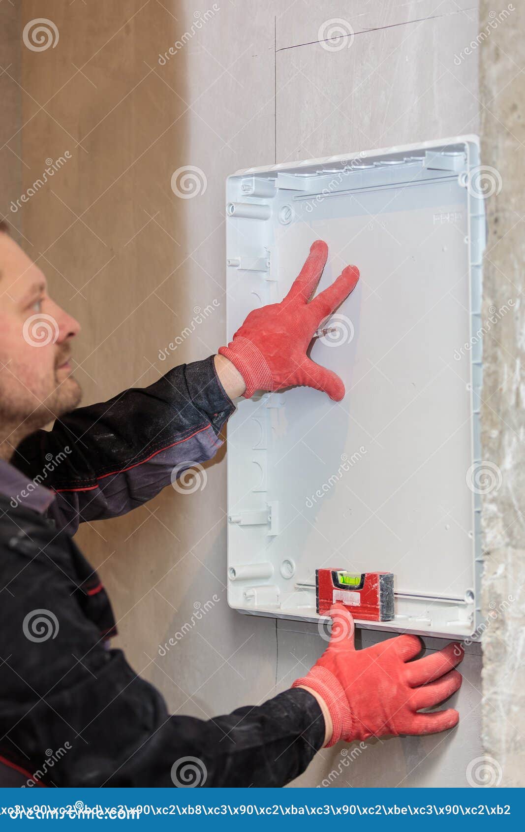 The Electrician Tries on and Marks the Lines of the Electrical Panel ...