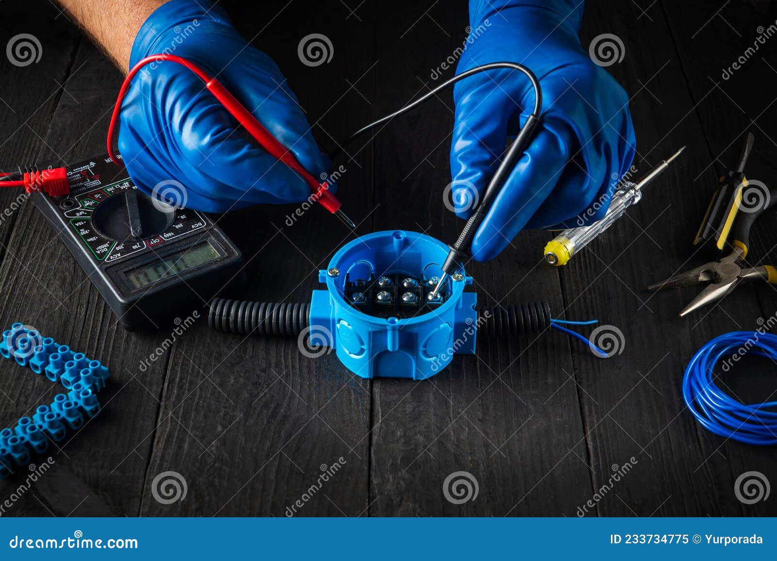 An Electrician Uses a Tester To Check the Contacts in the Blue Junction ...