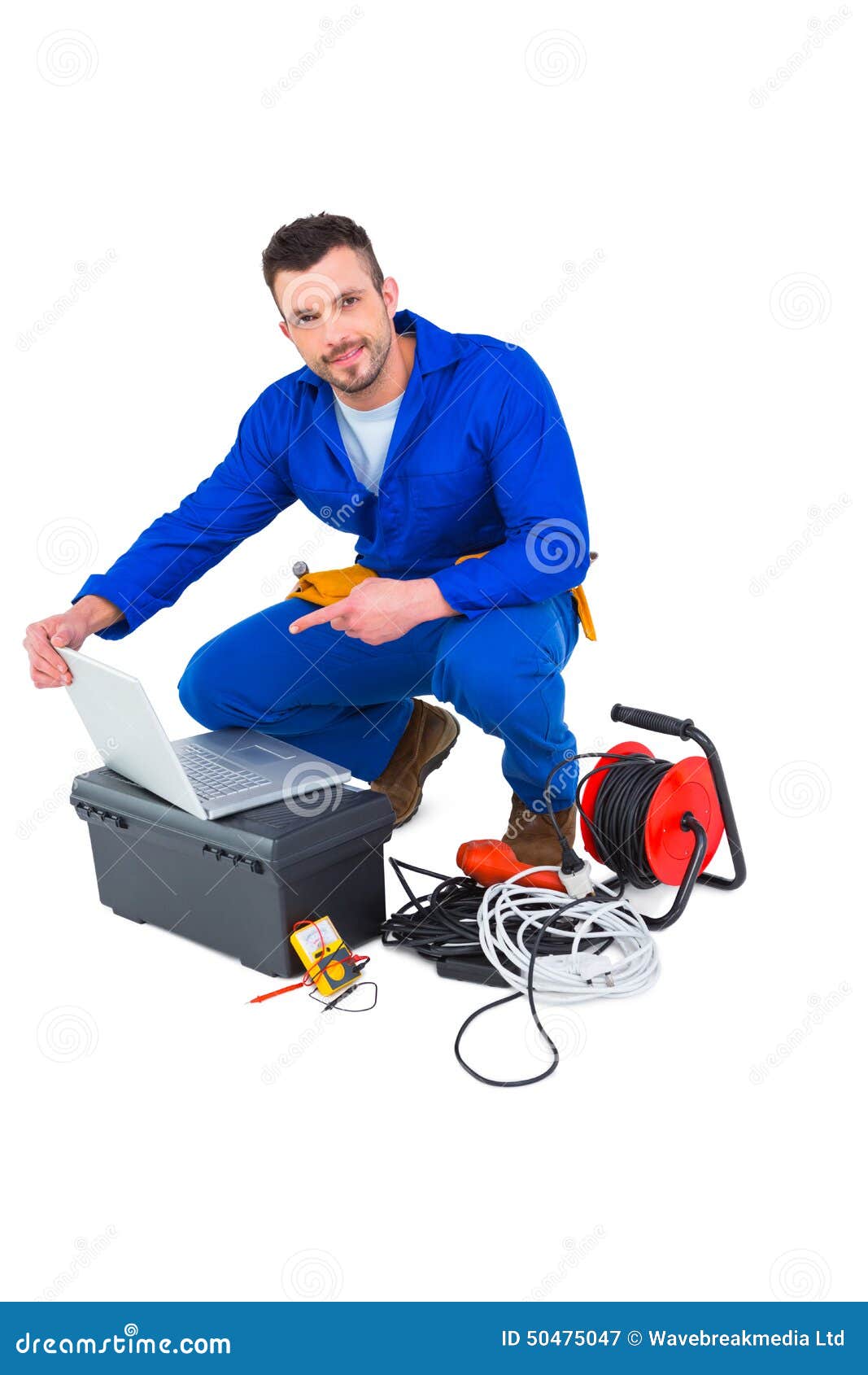 Electrician using laptop stock image. Image of belt, standing - 50475047
