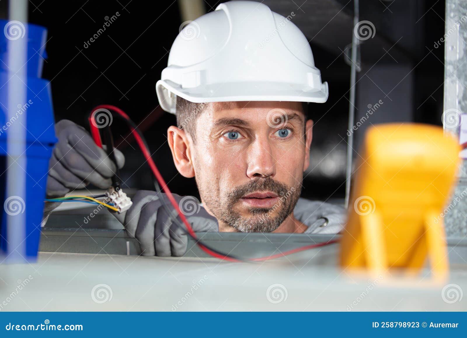 Electrician Using Multimeter in Confined Space Stock Image - Image of ...