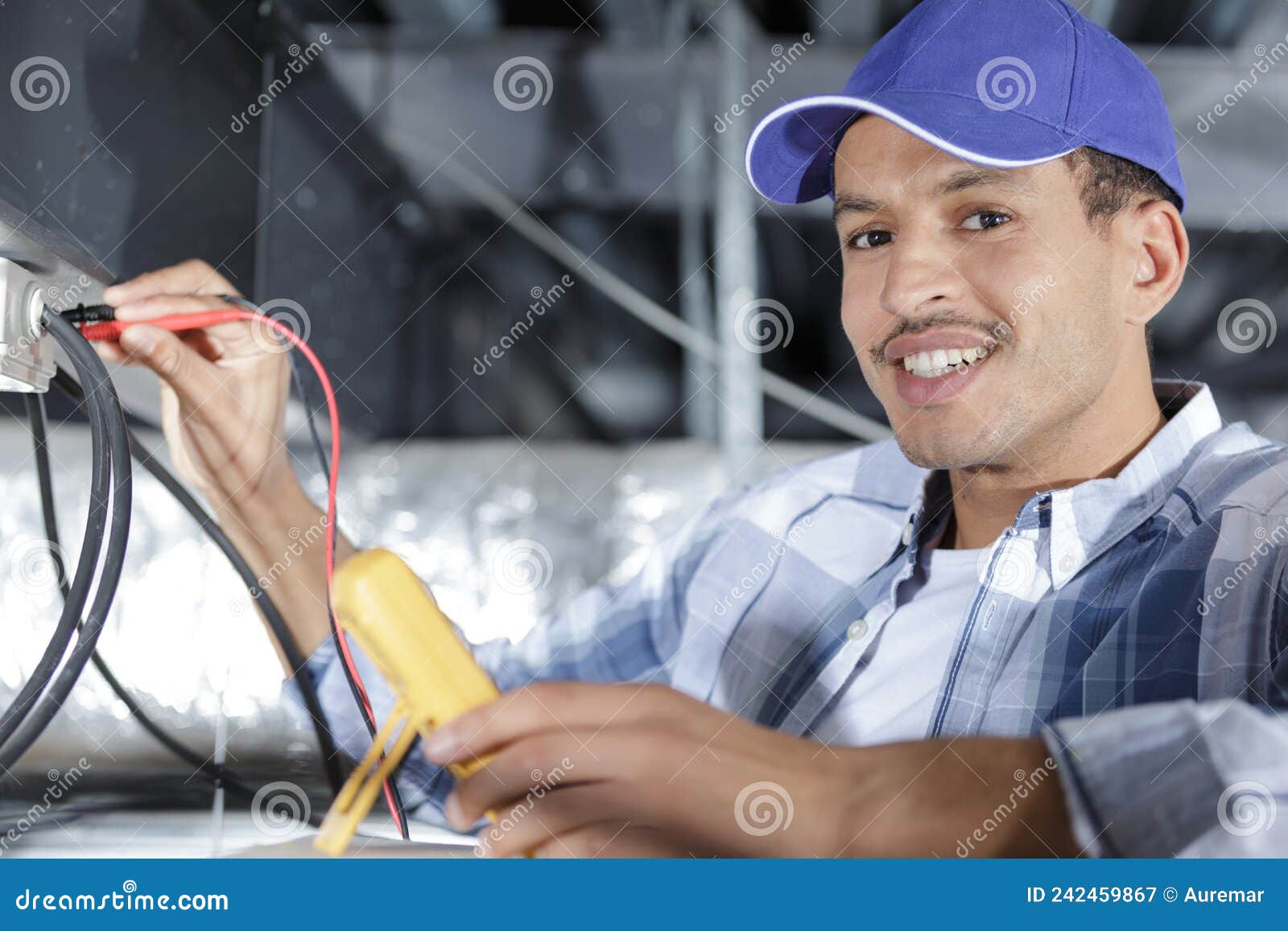Electrician Using Multimeter in Roof Space Stock Image - Image of ...