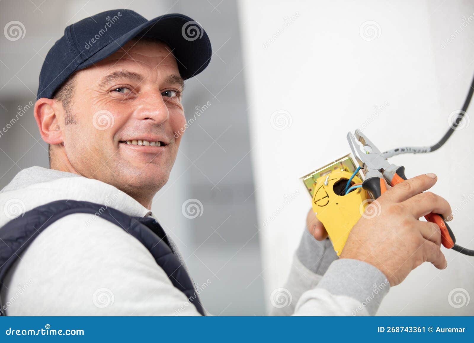 Electrician Using Multimeter and Smiling Stock Image - Image of ...