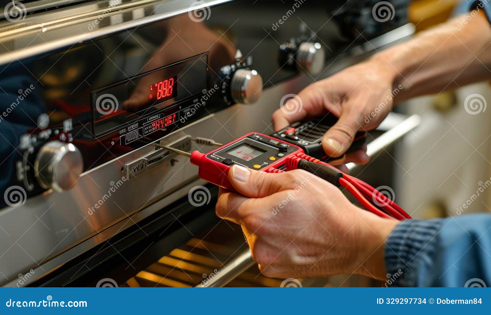 Electrician Using a Multimeter To Measure Electrical Current in an Oven ...