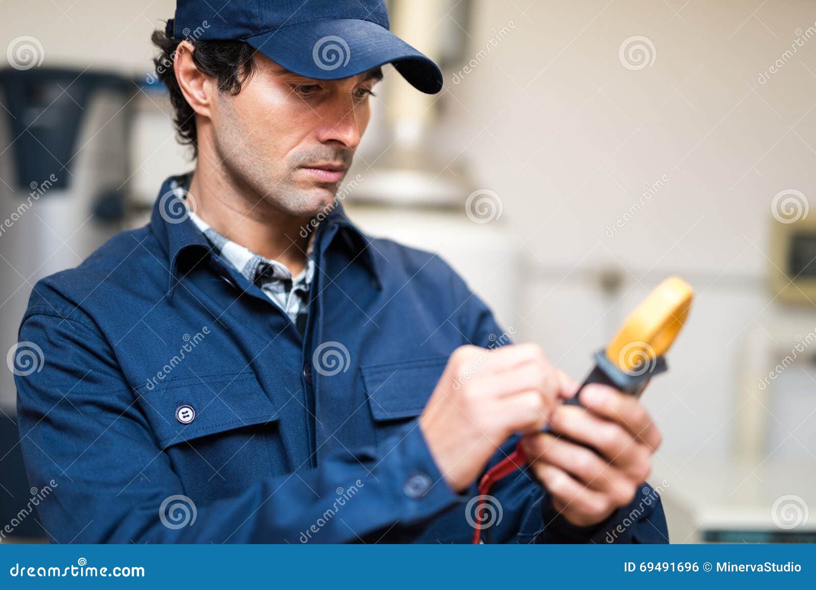 Electrician using a tester stock photo. Image of industry - 69491696