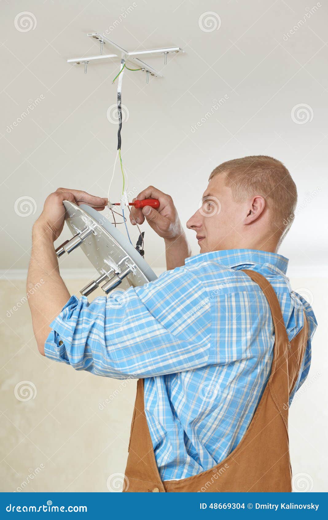 Electrician at wiring work stock photo. Image of mechanic - 48669304