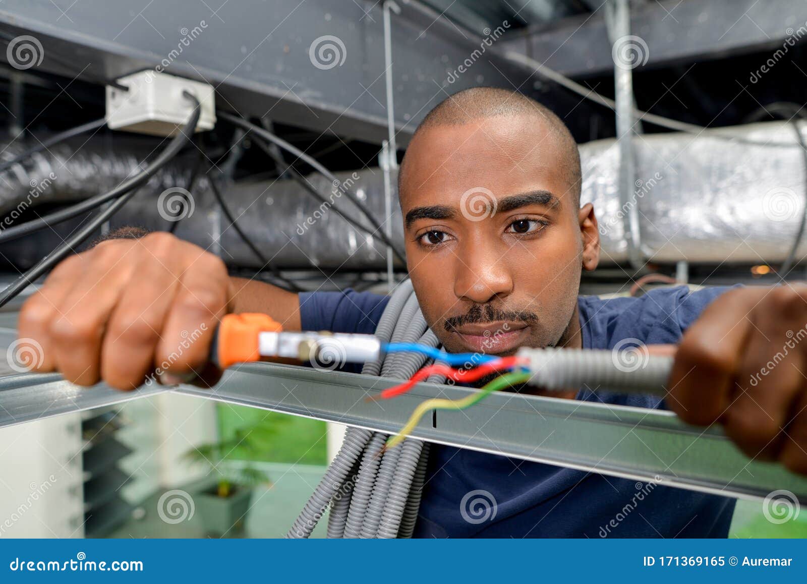 Electrician at work stock image. Image of exposed, install - 171369165