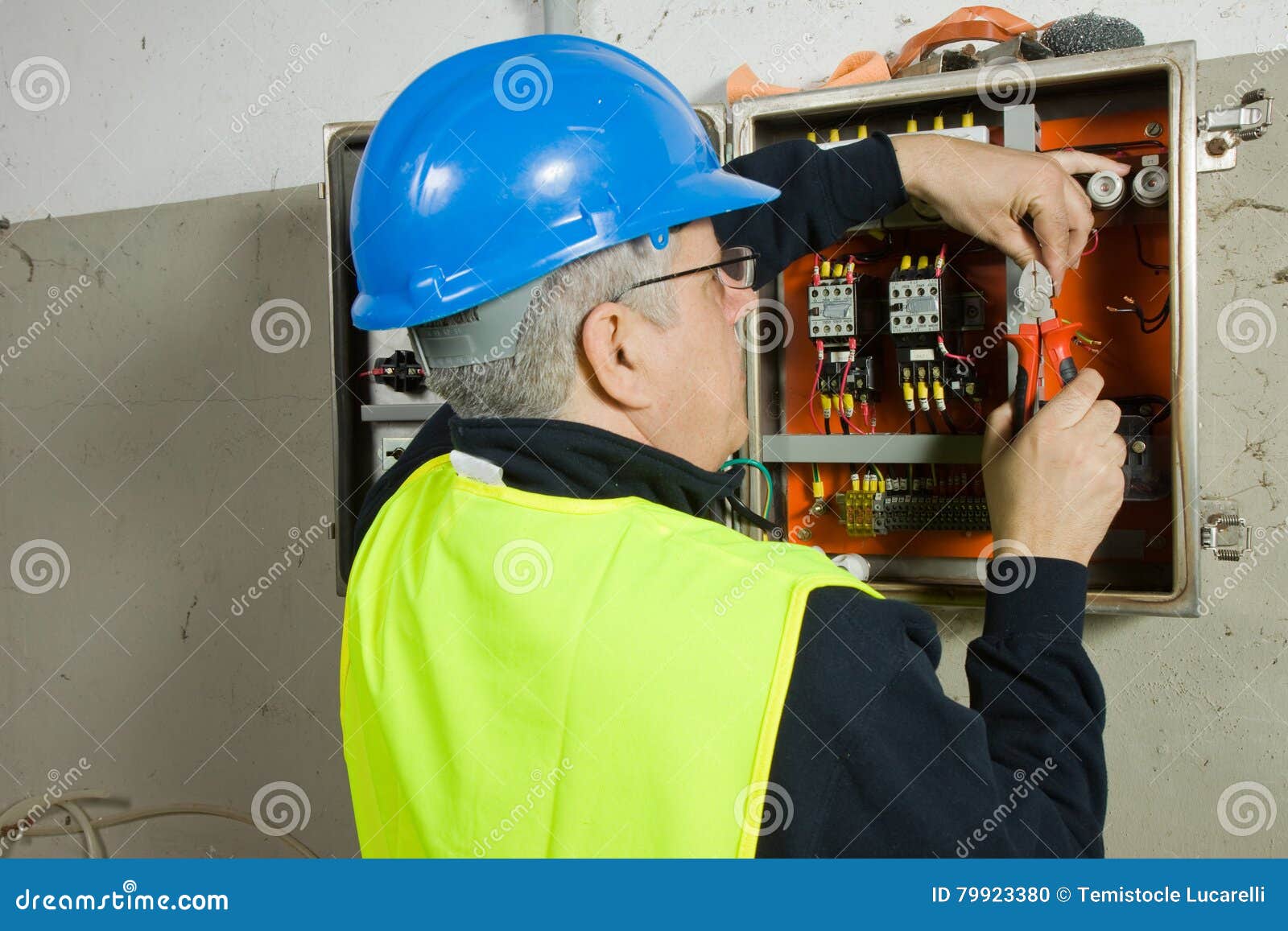 Electrician at work stock photo. Image of electricity - 79923380