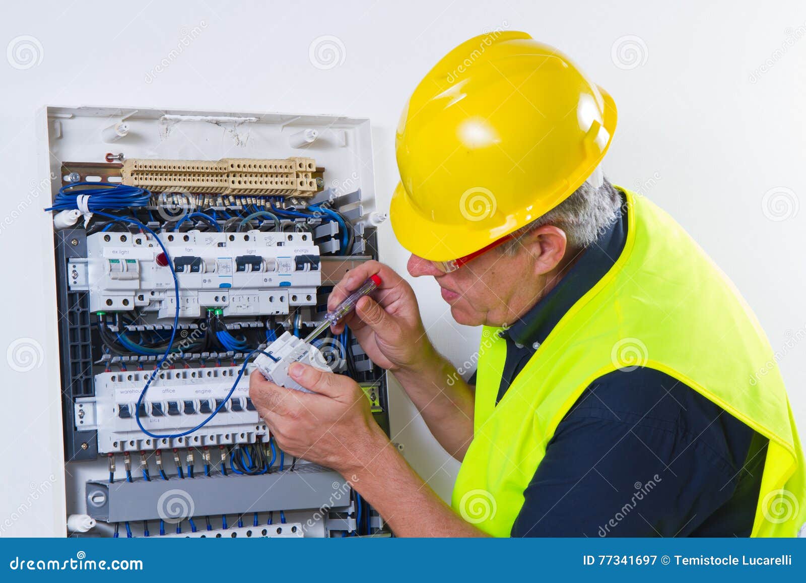 Electrician at work stock image. Image of installation - 77341697