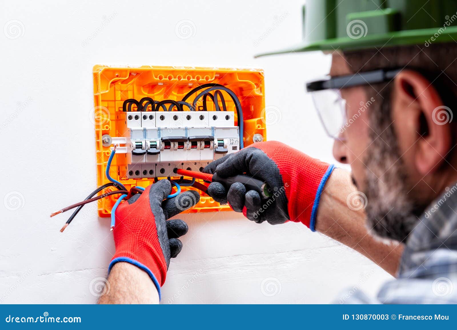 Electrician at Work on an Electrical Panel. Stock Image - Image of ...