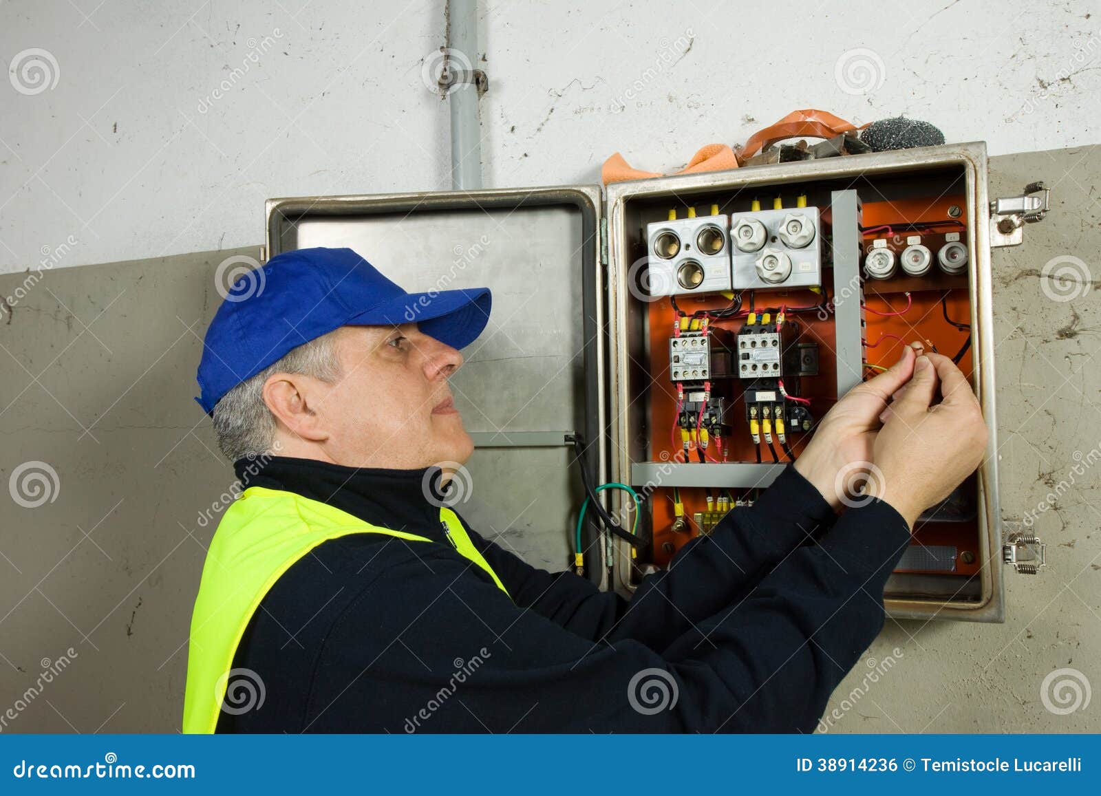 Electrician at work stock photo. Image of repair, hand - 38914236