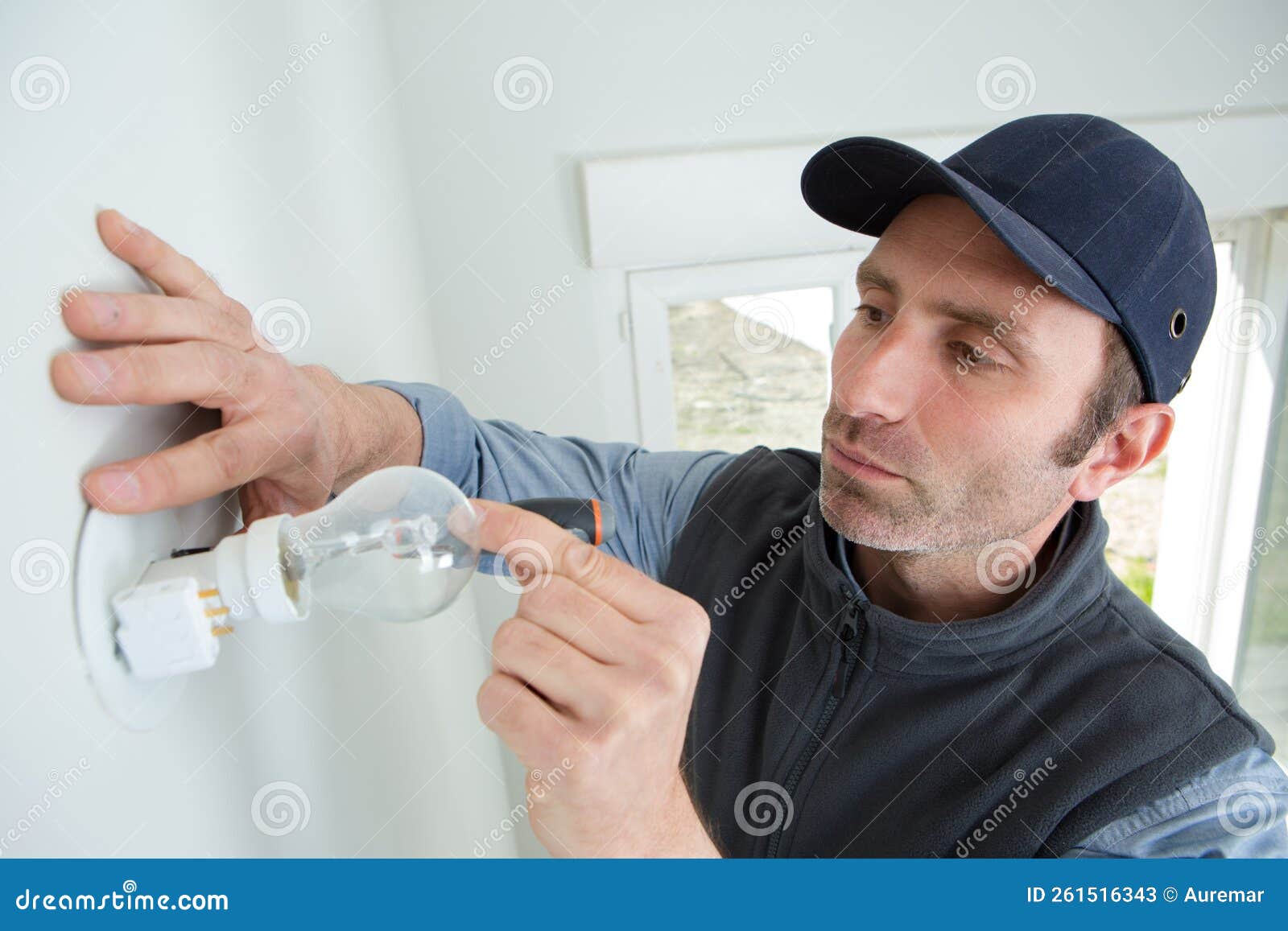 Electrician at Work - Installing Lamp on Wall Stock Image - Image of ...