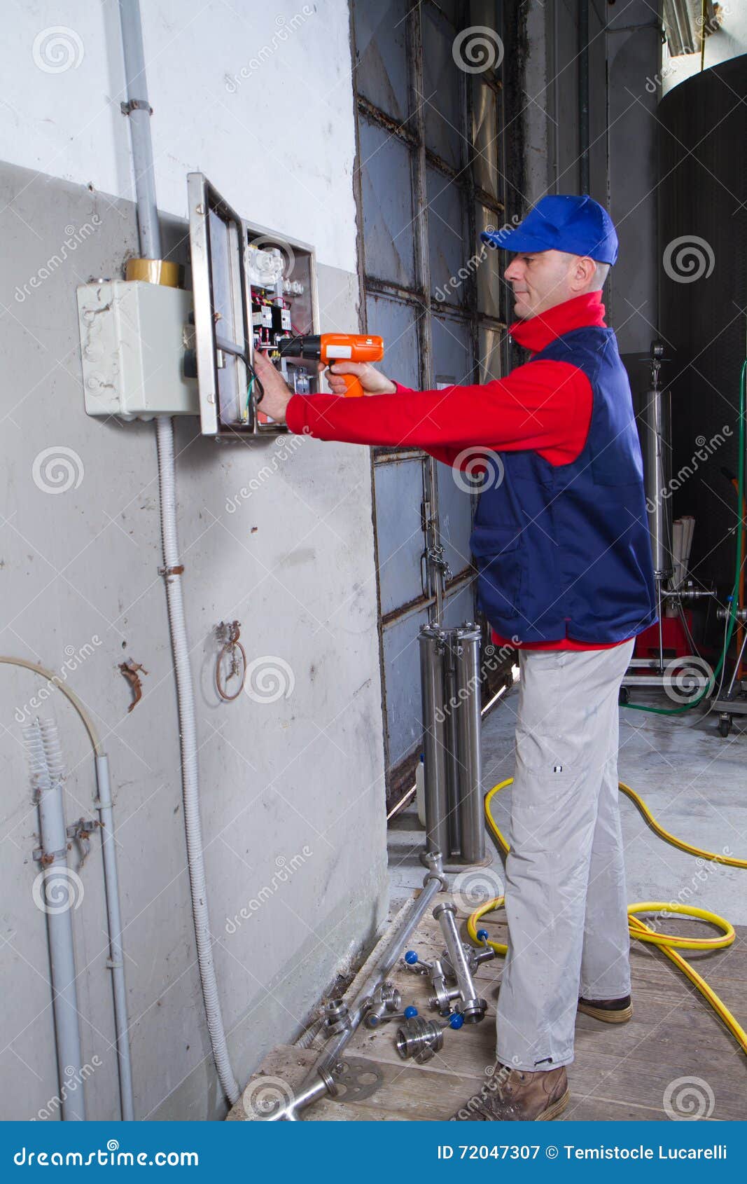 Electrician at work stock image. Image of electric, mounting - 72047307