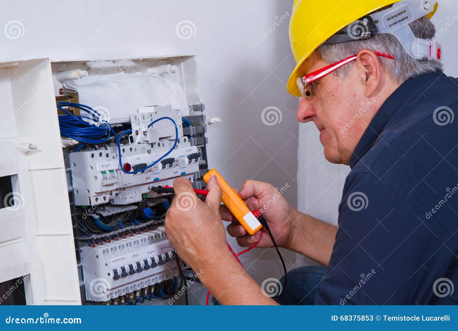 Electrician at work stock image. Image of alarm, installing - 68375853