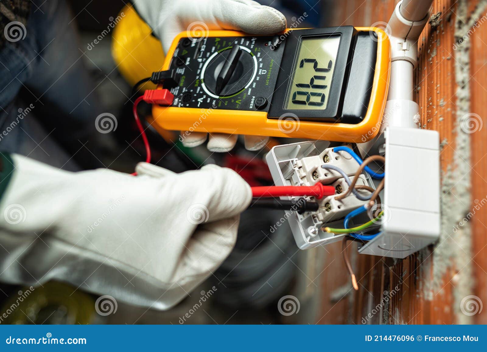 Electrician at Work on a Residential Electrical System. Electricity ...