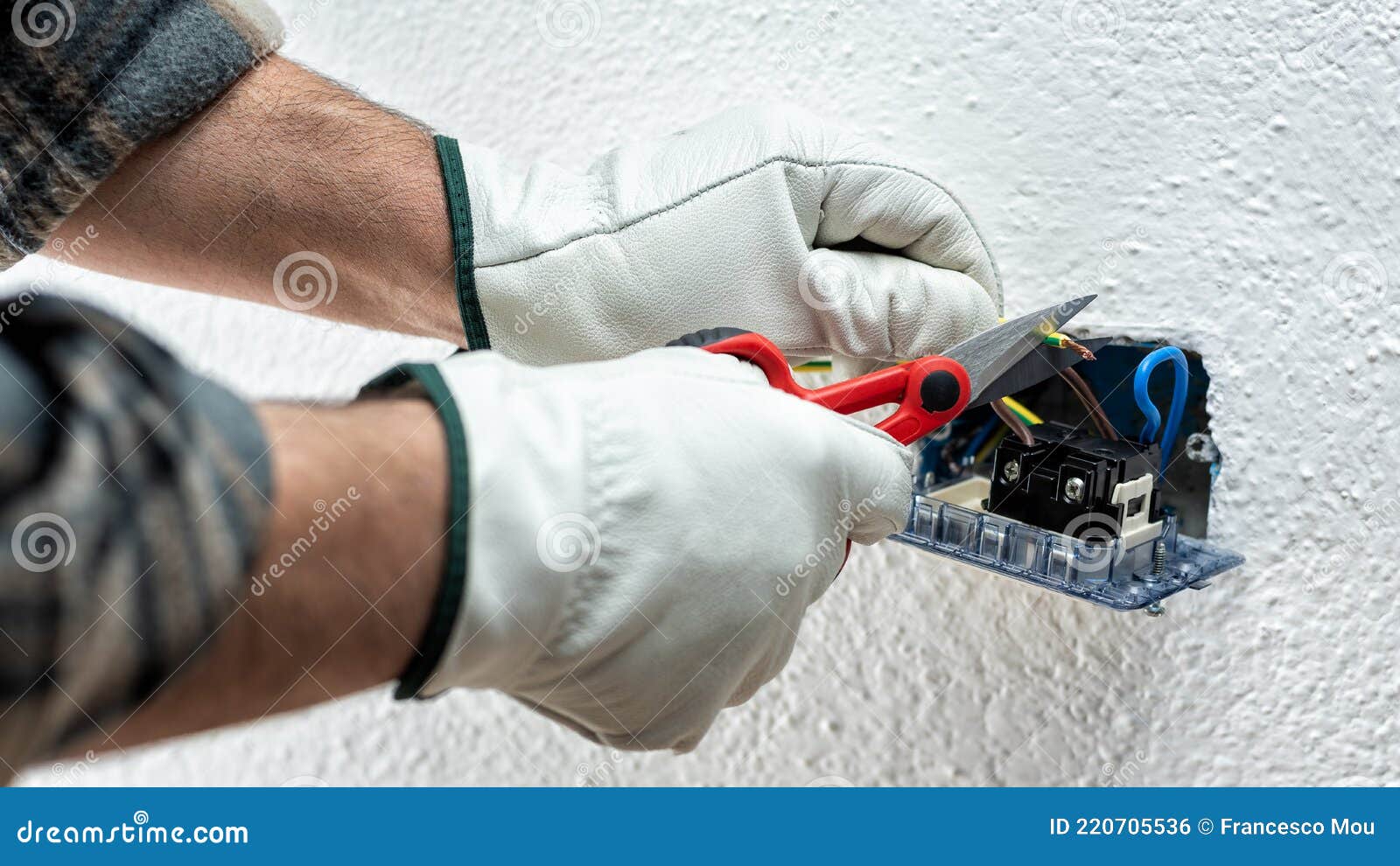 Electrician at Work on a Residential Electrical System. Electricity ...