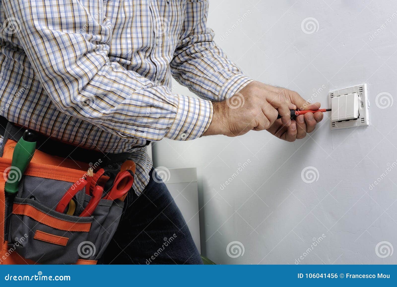 Electrician Working in a Residential Electrical System Stock Photo ...