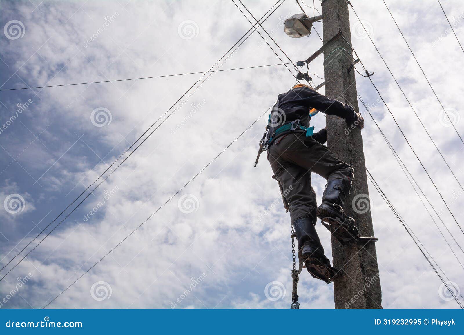 Electrician Worker Climbs the Pole To Repair Electrical Equipment Stock ...