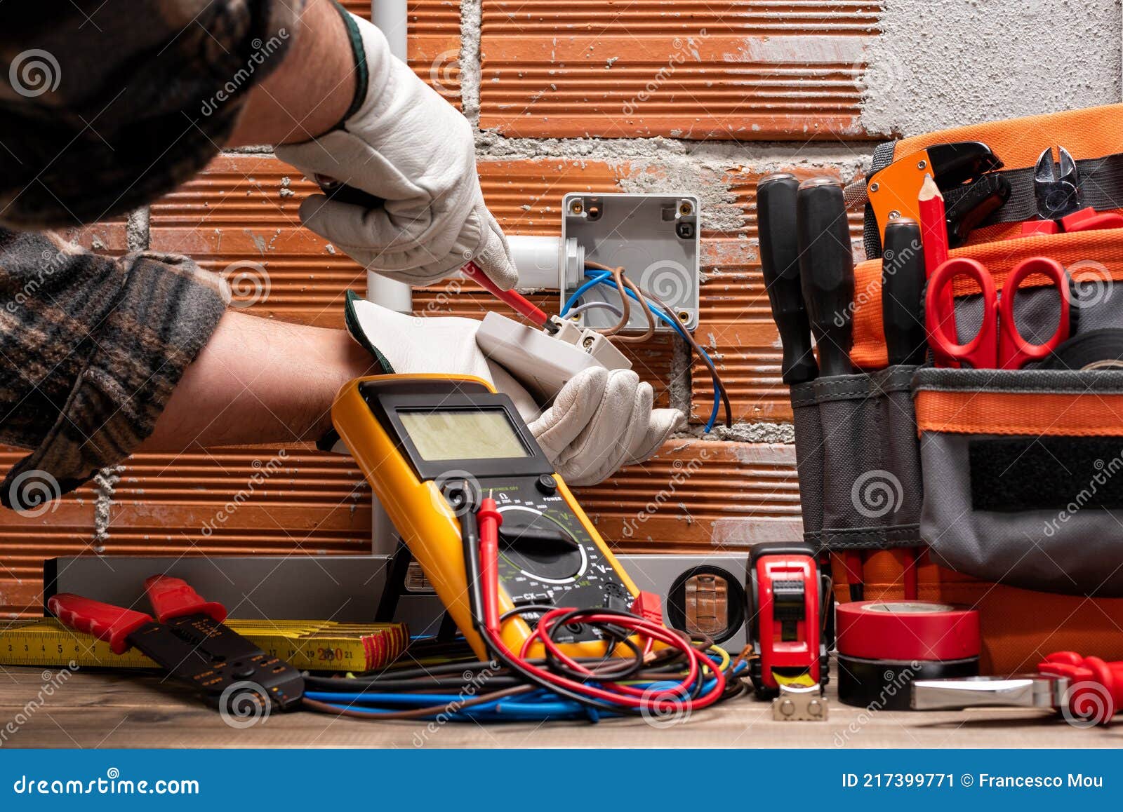 Electrician at Work on a Residential Electrical System. Electricity ...
