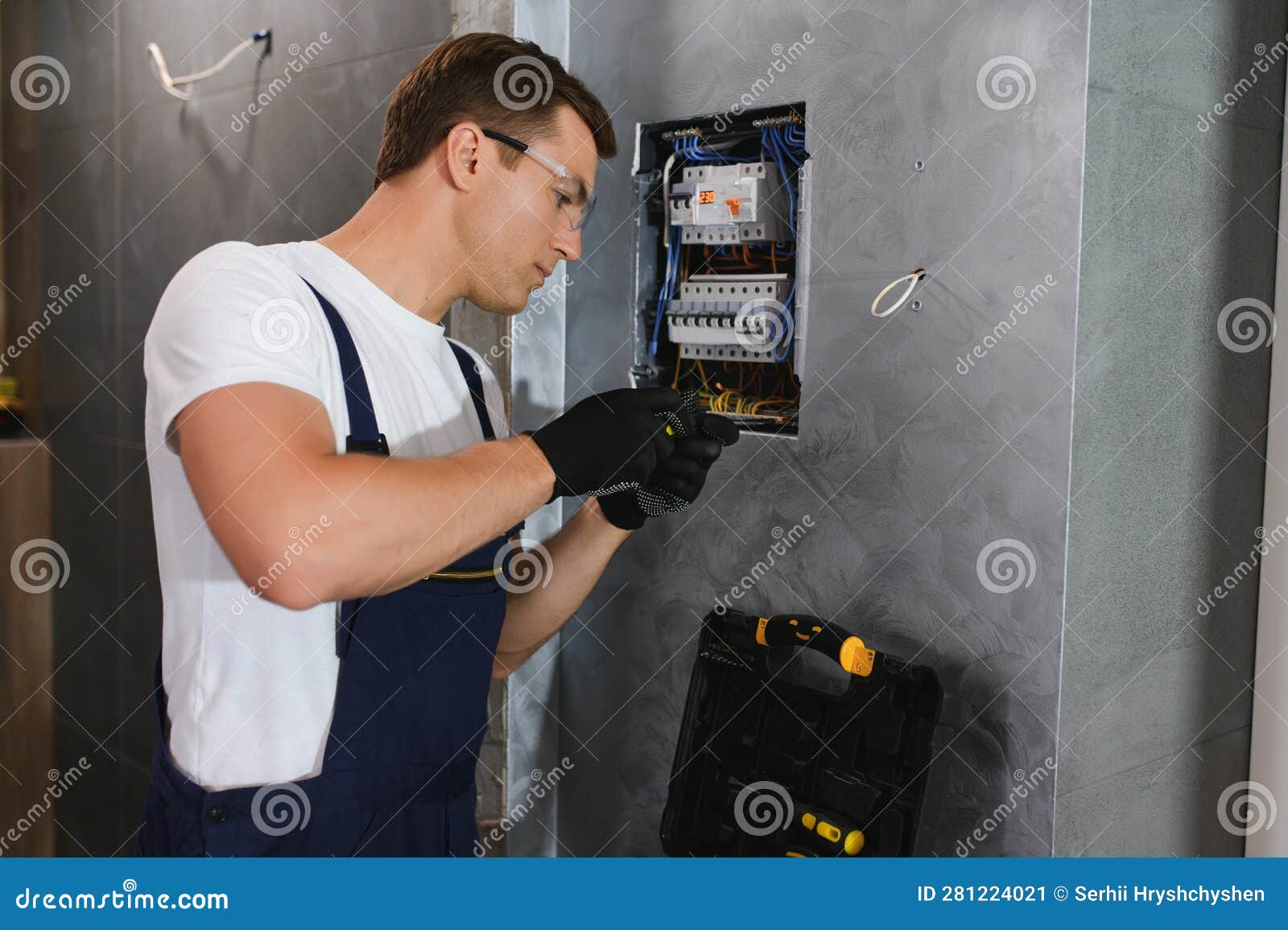 Electrician Worker at Work on an Electrical Panel Stock Image - Image ...