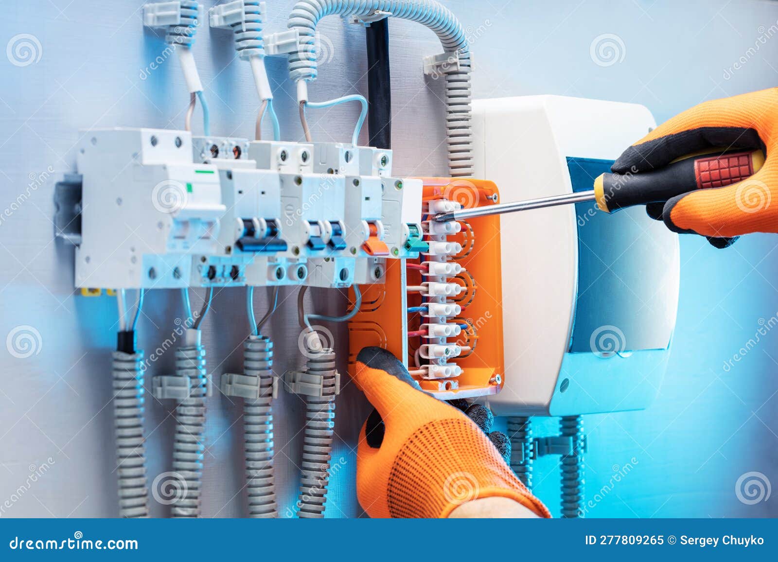 Electrician Worker at Work on an Electrical Panel. Stock Image - Image ...