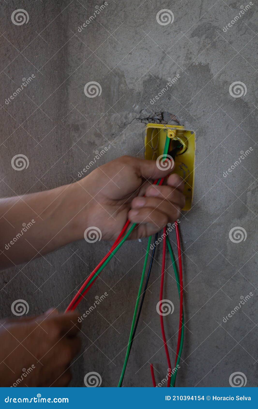 Electrician Working on a Construction Site. Electrical Wiring in a ...