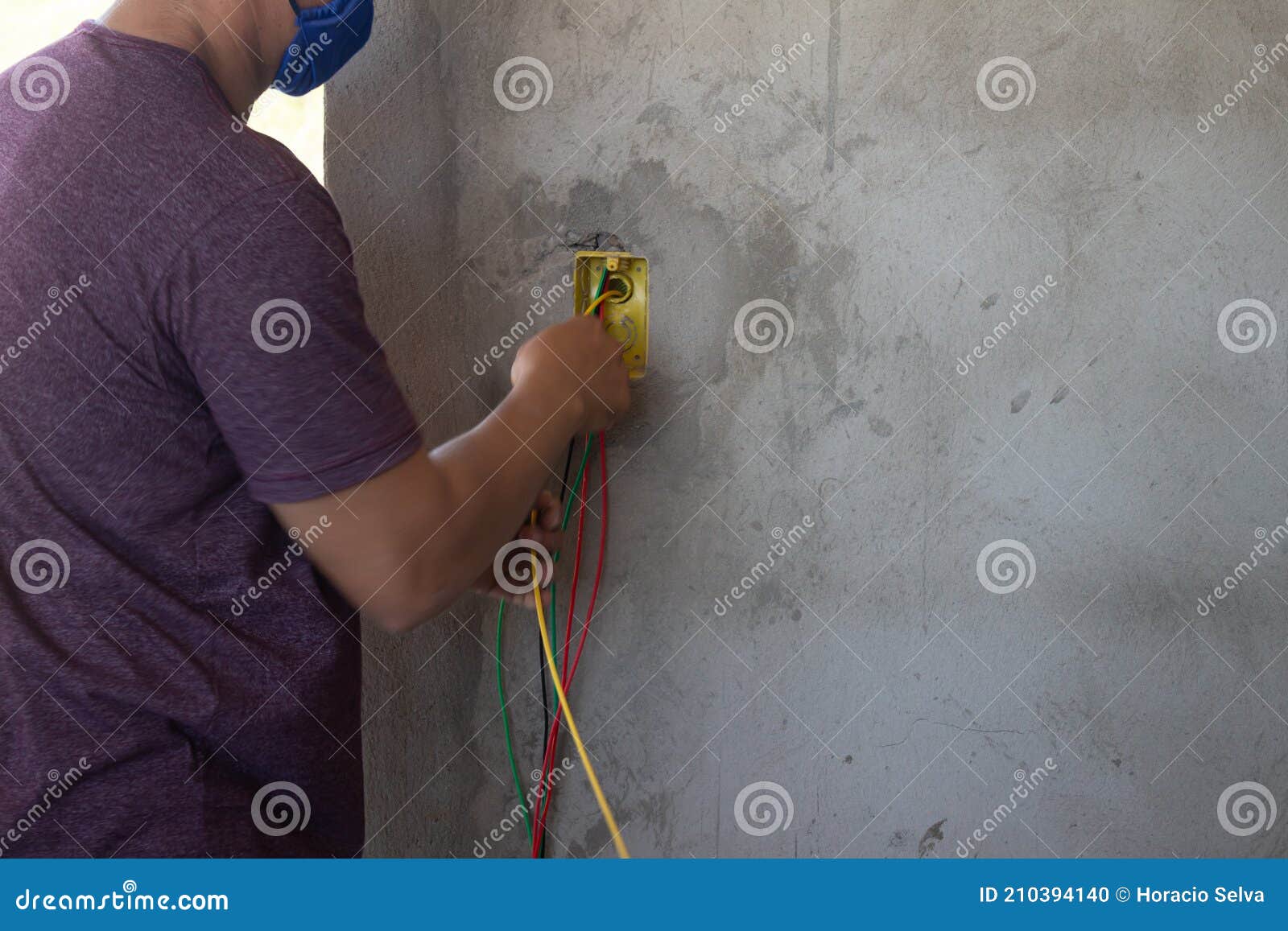 Electrician Working on a Construction Site. Electrical Wiring in a ...