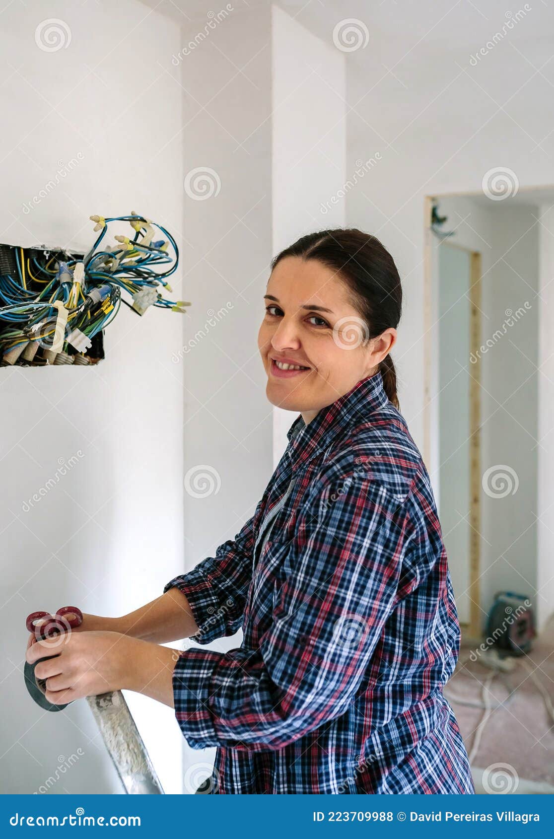 Electrician Working on the Electrical Installation of a House Stock ...