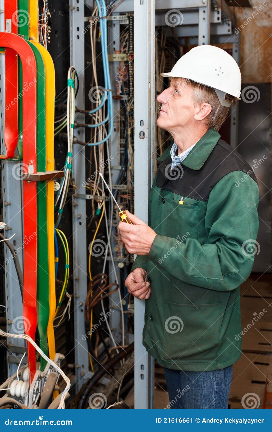 Electrician Working in Hard Hat with Cables Stock Image - Image of ...
