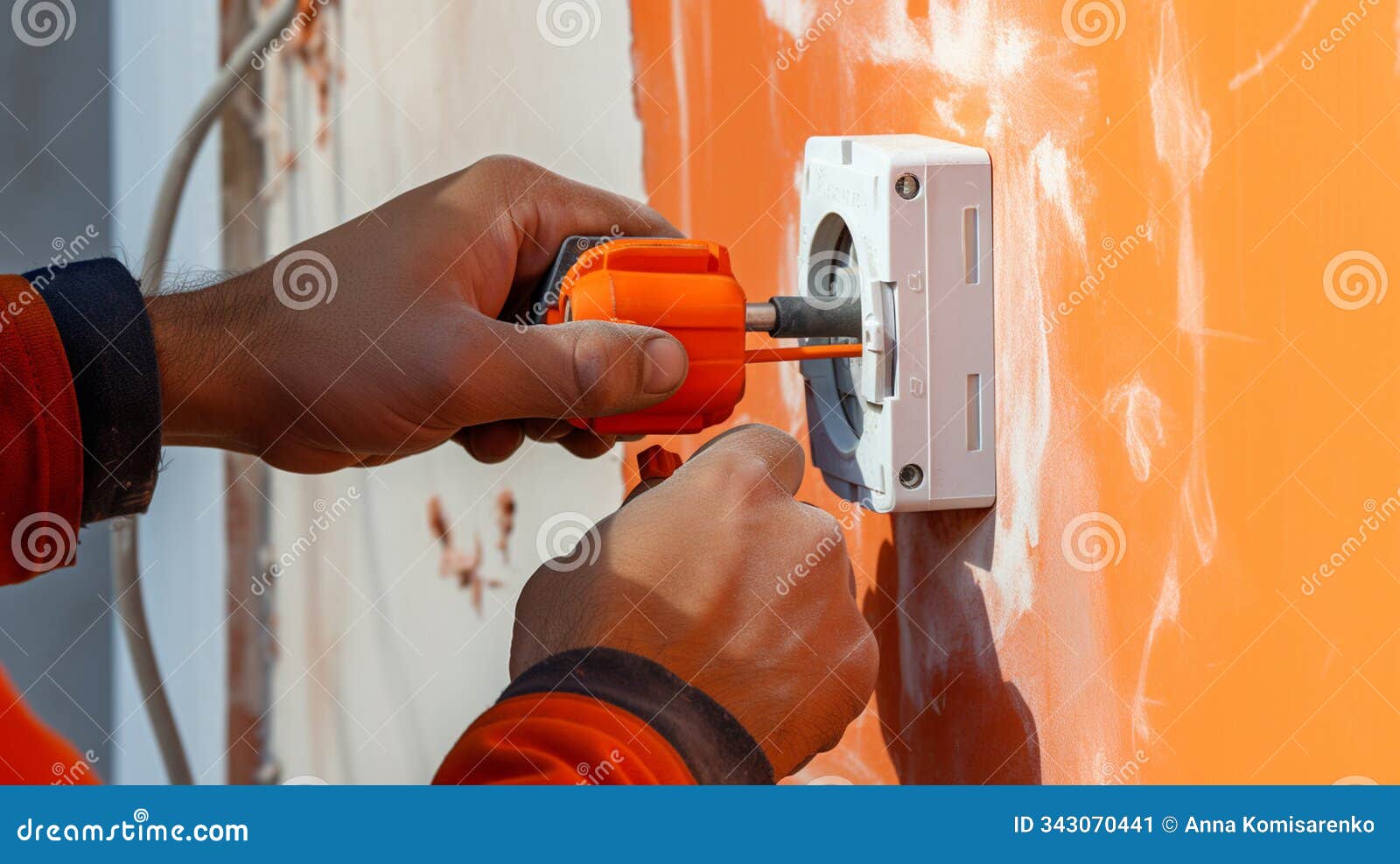 Electrician Working on a Home Electrical System, he is Installing a ...