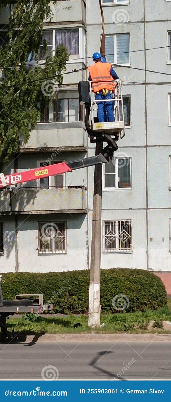 An Electrician is Working on a Pole Editorial Photo - Image of ...