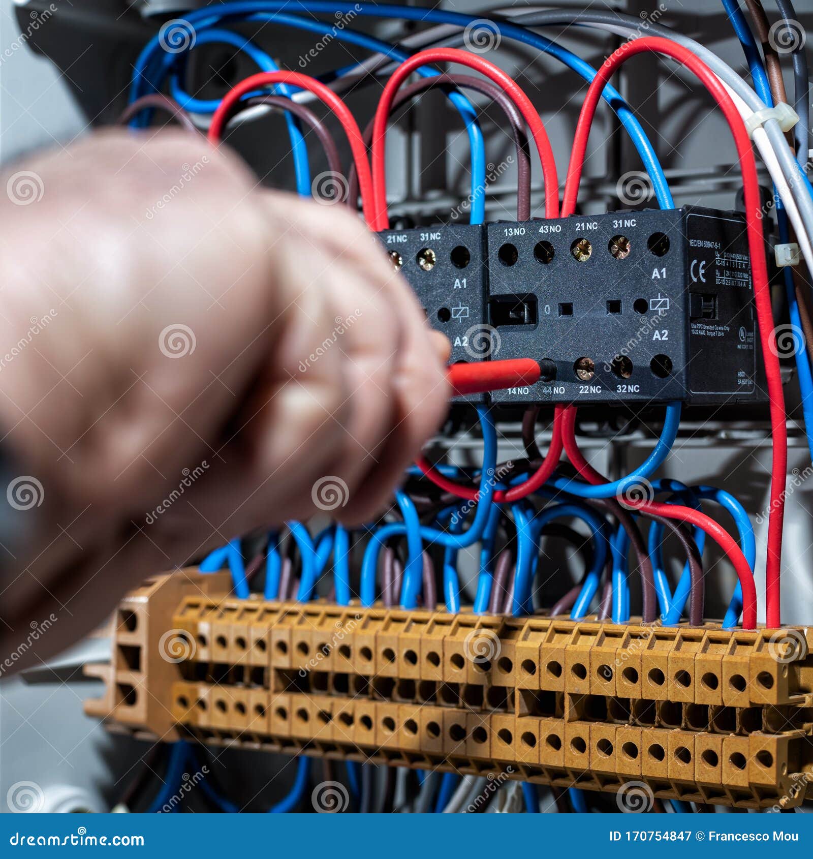 Electrician Working on a Residential Electrical Panel. Electricity ...