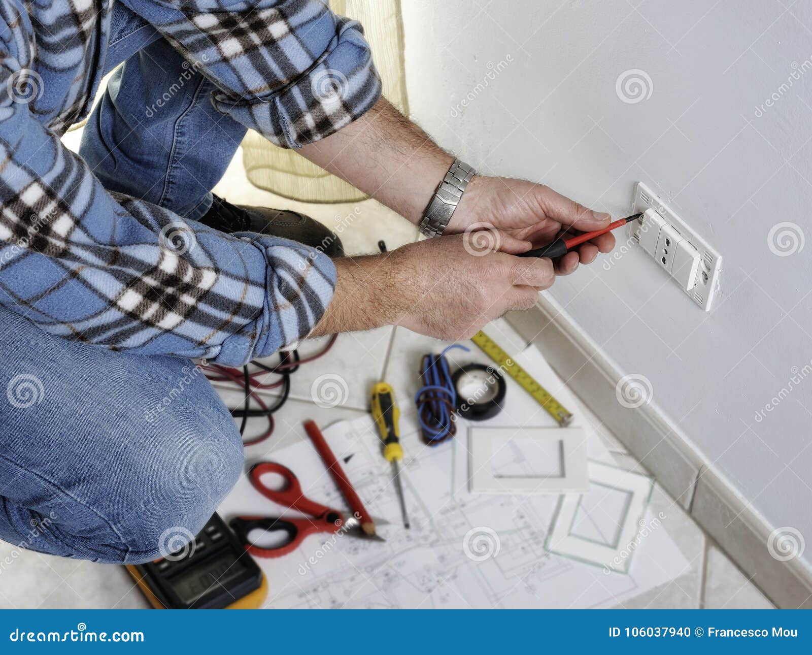 Electrician Working in a Residential Electrical System Stock Photo ...