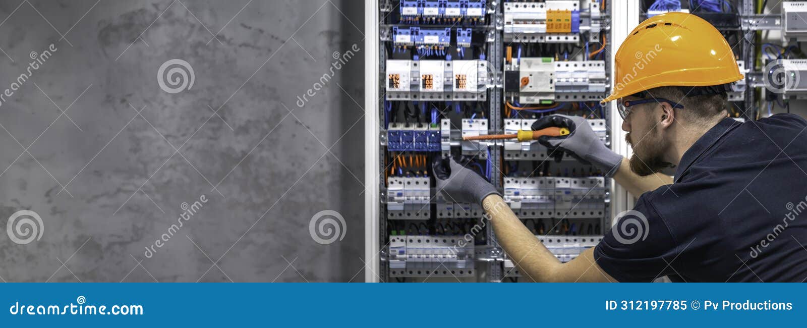 Electrician Working in Switchboard with Electrical Connection Cable ...