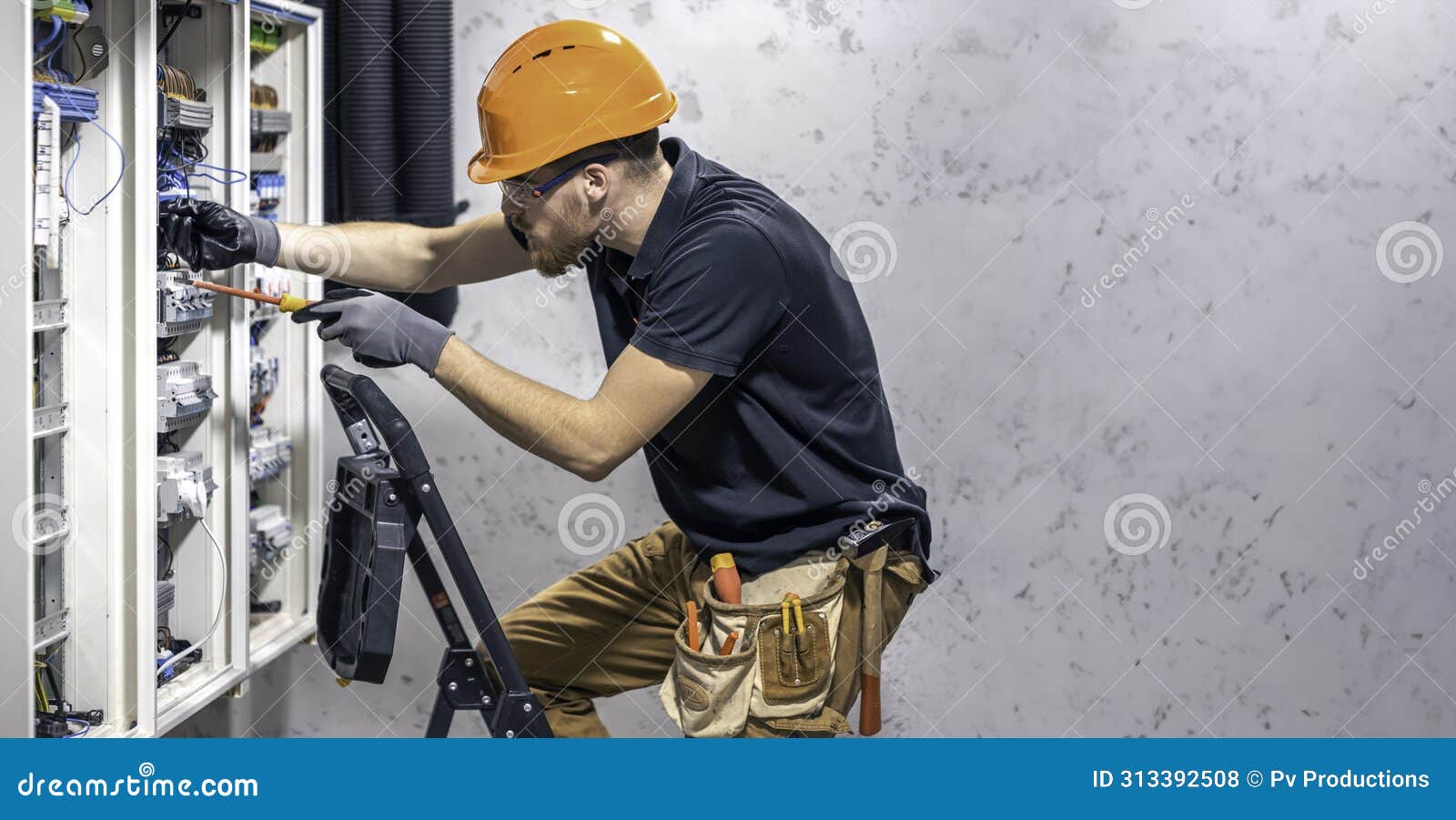 Electrician Working in Switchboard with Electrical Connection Cable ...