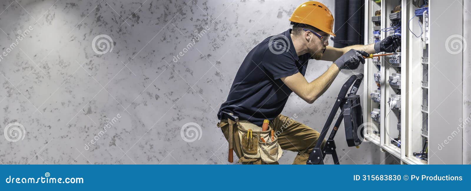 Electrician Working in Switchboard with Electrical Connection Cable ...